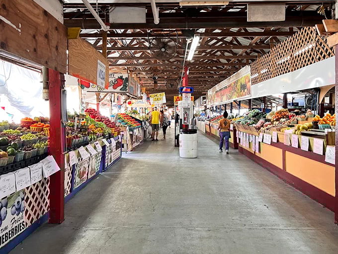 A produce paradise where strawberries gleam like rubies and shoppers navigate aisles of edible treasures. Welcome to flavor country!