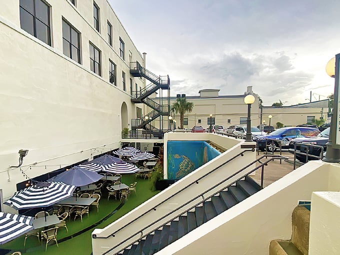 The secret staircase beckons with promise &ndash; each step down leads closer to culinary treasures hidden beneath Downtown DeLand's historic streets.