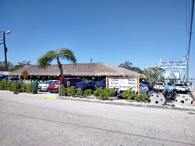 Walt's thatched-roof exterior beckons like a tropical mirage, promising seafood treasures under that palm-fringed paradise. Florida dining at its most authentic!