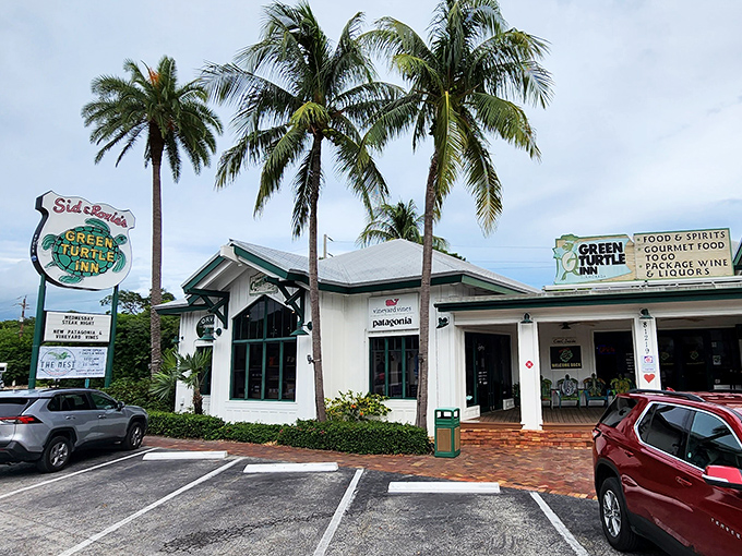 The iconic Green Turtle Inn welcomes hungry travelers with its charming white exterior and towering palm trees &ndash; a true Florida Keys landmark.