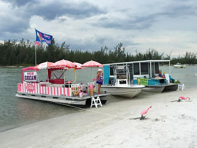 A candy-striped ice cream boat docked at Keewaydin's shore &ndash; where "brain freeze" comes with a side of paradise and zero regrets.