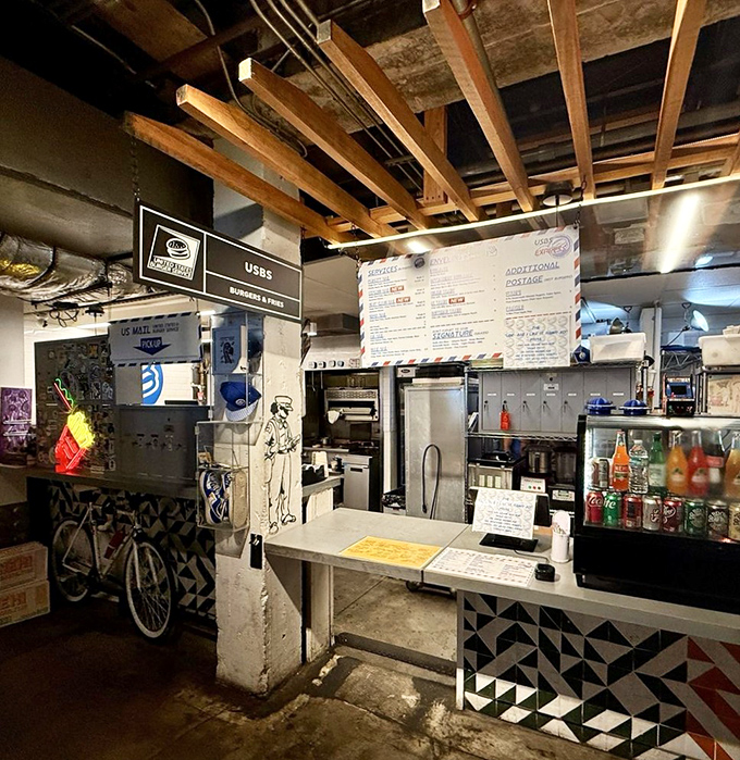 The counter at USBS welcomes hungry patrons with its postal-inspired design &ndash; where burgers are sorted, stamped, and delivered with flavor-forward precision.