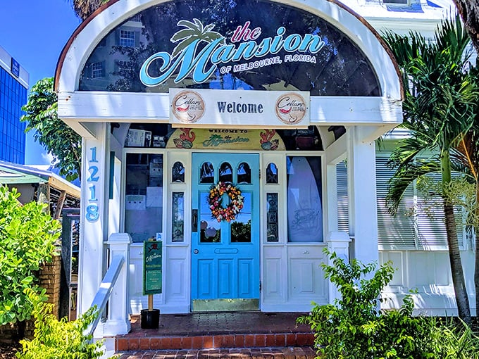 The welcoming turquoise door of The Mansion beckons visitors into a Victorian time capsule where culinary adventures await.