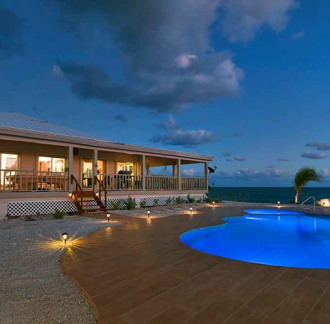 At night, the island transforms into something magical, lit up like a jewel in the darkness, proving paradise works the night shift too.