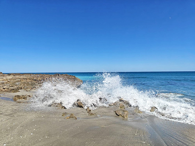 Atlantic waves crash dramatically against ancient limestone, nature's own percussion section performing a timeless symphony of water meeting stone.