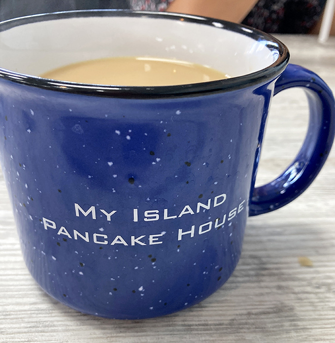 Their signature blue coffee mug – the perfect vessel for liquid motivation and a souvenir that reminds you why mornings were invented in the first place.