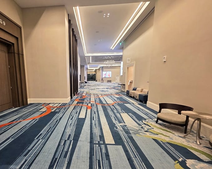 Modern elegance defines the hotel's interior corridors, where cool comfort awaits after a day of aquatic adventures.