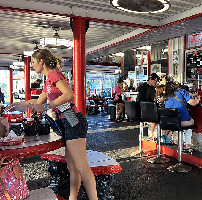 The dining area buzzes with the energy of satisfied customers, where every table tells a story and every meal creates a memory.