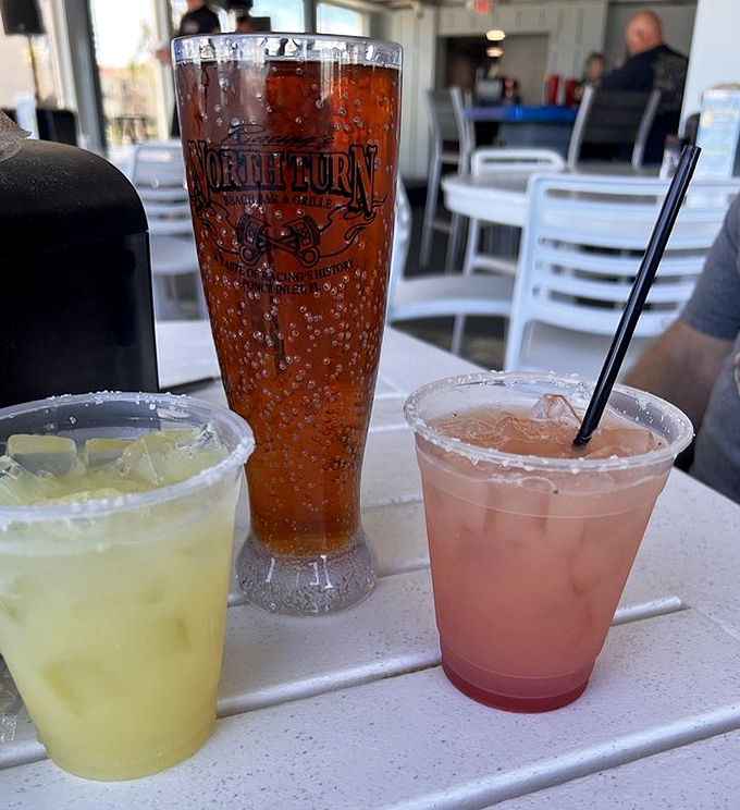 Colorful cocktails line up like cars at the starting line&mdash;refreshing, vibrant, and ready to complement your oceanfront dining experience.