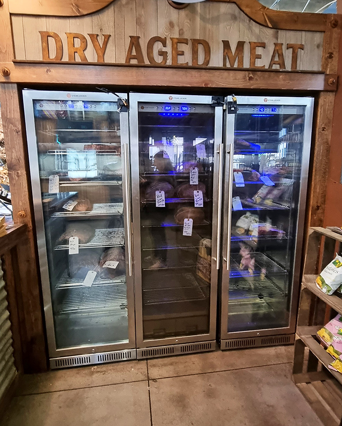 The dry-aging meat display showcases premium cuts behind glass &ndash; a carnivore's dream and a testament to butchery as art.