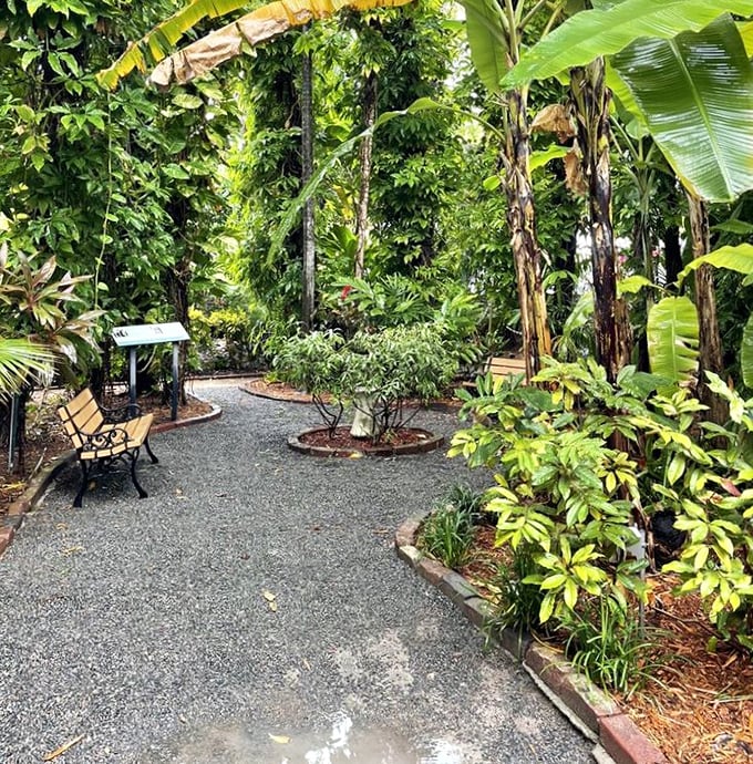 Winding paths through lush tropical gardens invite visitors to wander and wonder, just as Hemingway once did.