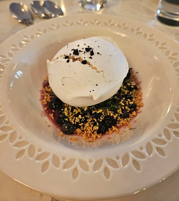 A cloud-like meringue resting on a bed of berries &ndash; the kind of dessert that makes you reconsider your "I'm too full" stance.