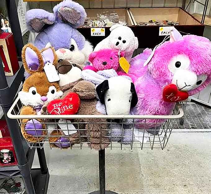 Stuffed animals waiting for their forever homes &ndash; that pink bunny has perfected its "take me home" eyes after years of professional practice.