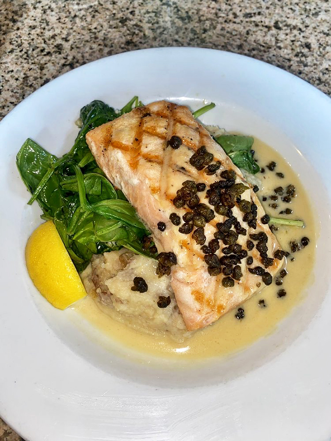 Salmon perched atop a cloud of mashed potatoes with fried capers standing guard&mdash;seafood elevated to an art form.