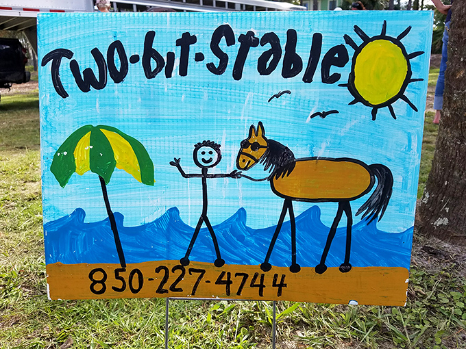 The charming hand-painted sign captures the laid-back, friendly spirit that makes Two-bit Stable a beloved local treasure.