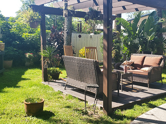 Sunlit Patio Seating: The perfect spot for morning coffee or evening cocktails &ndash; shared with only the living guests, most of the time.