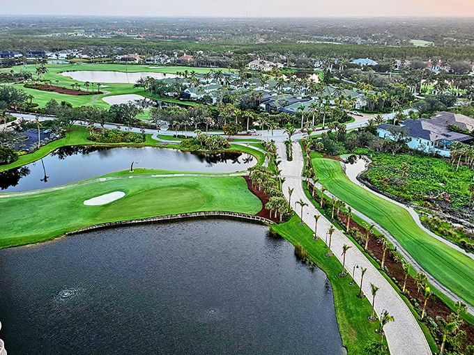 Golf courses and waterways create a patchwork quilt of leisure from above, where every shade of green competes for attention.