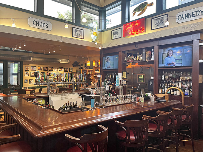 The bar serves as the heart of the operation, where skilled bartenders craft tropical concoctions and pour generous glasses of island hospitality.