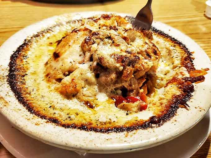 Cheesy dish: Molten cheese creates a crater of comfort. Archaeologists of flavor will be excavating this delicious site until the plate's clean.