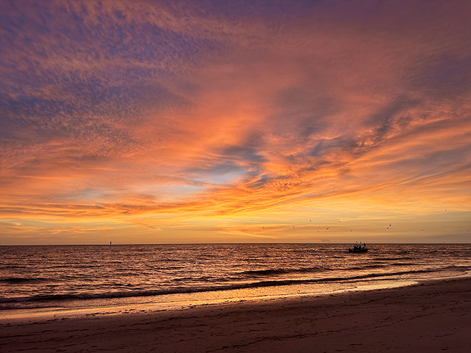 Florida's farewell symphony: The sun puts on its nightly spectacular, painting the Gulf waters in impossible shades of amber and gold.