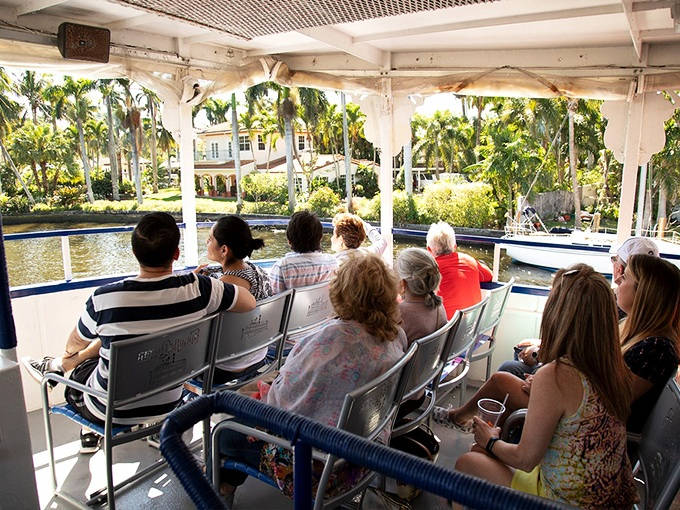 Passengers enjoy the gentle breeze and unobstructed views from the open-air deck &ndash; the best seats for mansion-spotting and dolphin-watching on the waterways.
