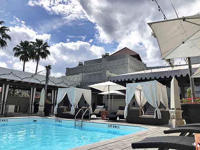 The courtyard pool at Casa Monica offers a peaceful retreat surrounded by the hotel's historic Spanish-inspired architecture.