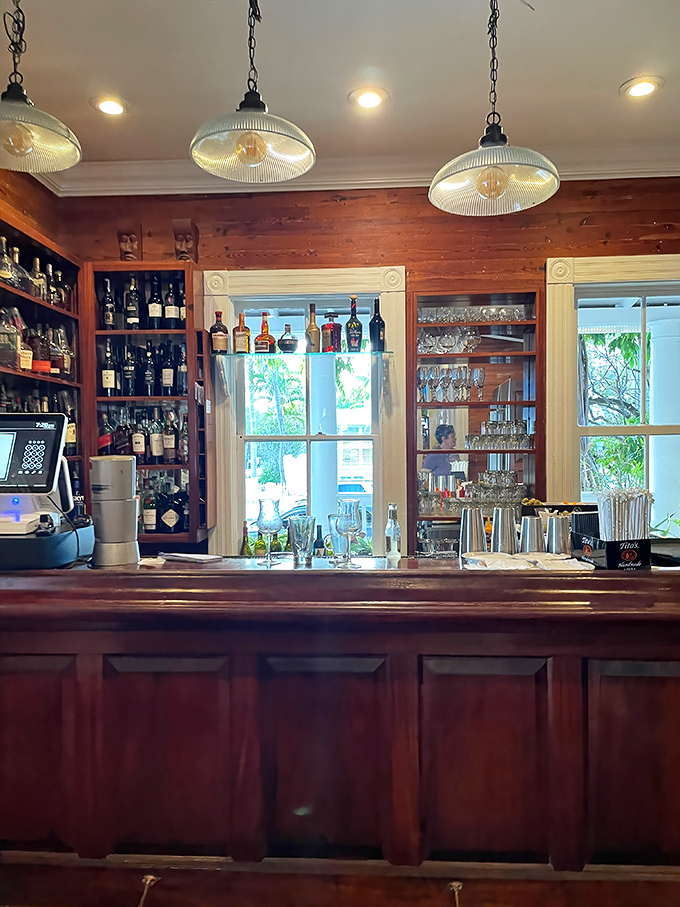 A bar stocked like a library of liquid happiness. The bottles stand at attention, ready to contribute to your vacation stories.