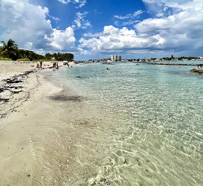 Gentle waves lap against the pristine shoreline where the transparent waters reveal every shell and pebble beneath &ndash; nature's own infinity pool.