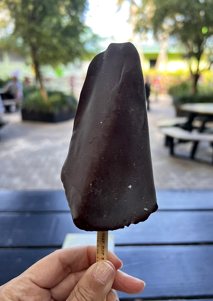 A chocolate-dipped key lime pie on a stick transforms a classic dessert into portable perfection &ndash; genius in both concept and execution.