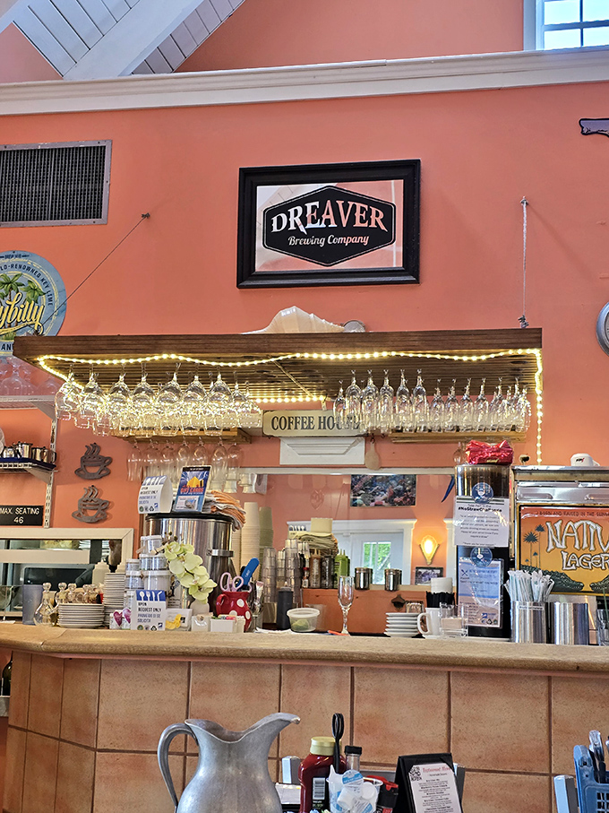 The bar showcases local brews beneath hanging glasses that catch the light like suspended raindrops &ndash; liquid treasures awaiting discovery.
