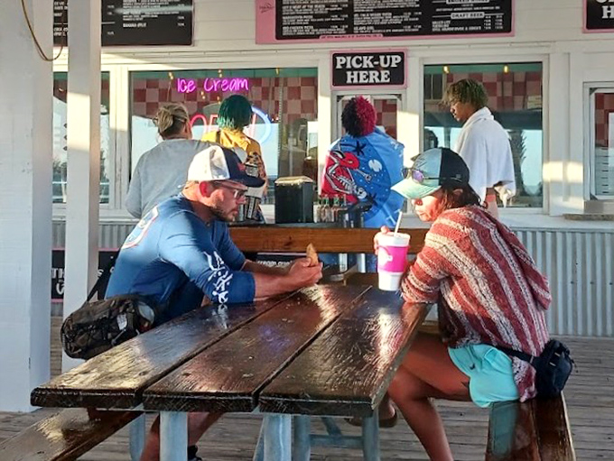 The outdoor seating area &ndash; where strangers become temporary friends united by the universal language of good food.