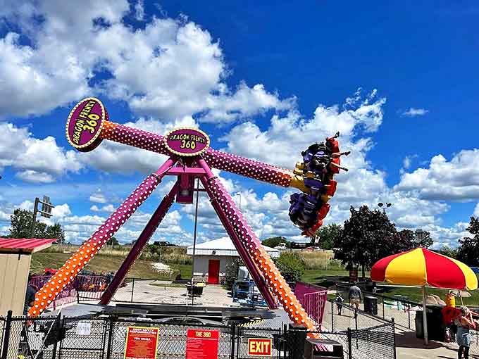Dragon Frenzy 360: This pink polka-dotted pendulum of joy swings riders through the air, temporarily rearranging their understanding of which way is up.
