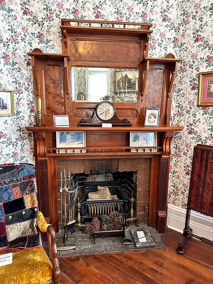 Antique furnishings frame the fireplace where visitors often report cold spots, even during Florida's sweltering summer months.