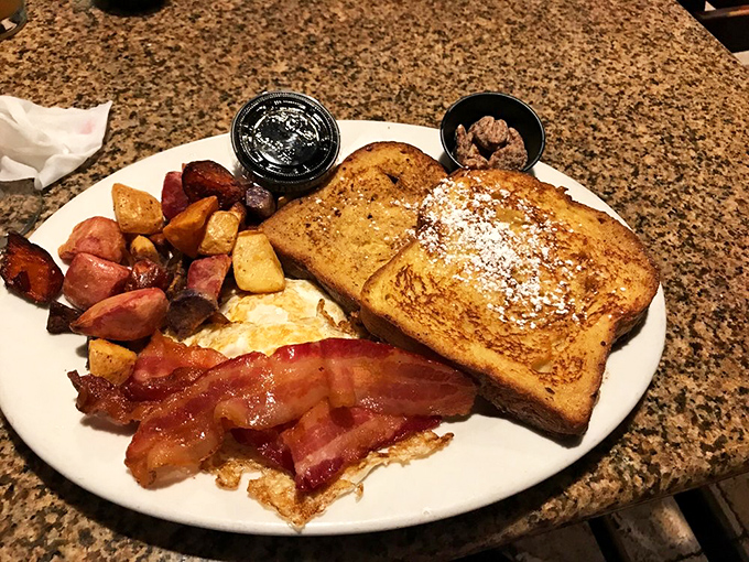 Breakfast that means business: golden French toast, eggs that know their purpose, and bacon that's achieved the perfect crisp-to-chew ratio.