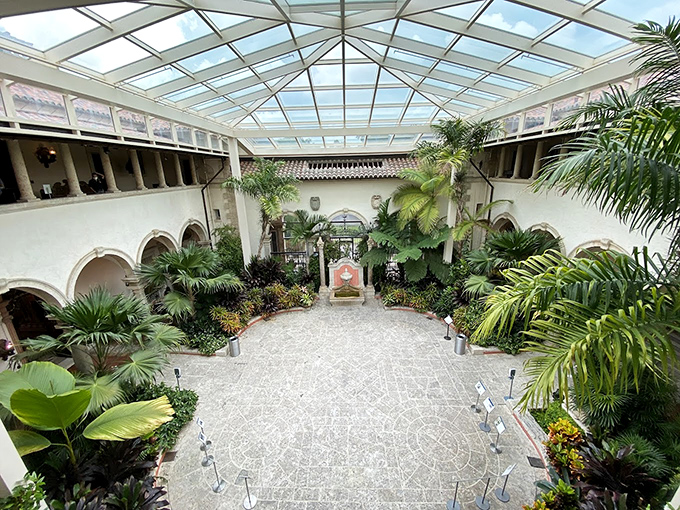 Tropical plants thrive under this glass ceiling, creating an indoor jungle that puts your struggling houseplants into therapy.