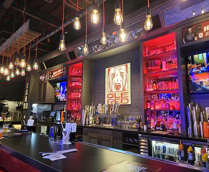 The bar gleams with promise under Edison bulbs &ndash; bottles backlit in red glow like rubies waiting to be transformed into cocktails.