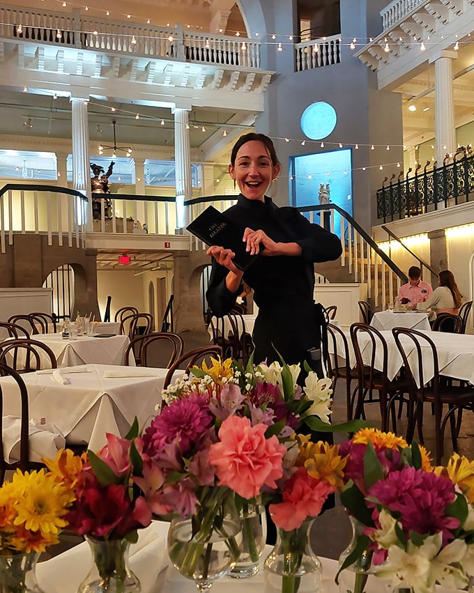 The staff navigates the former swimming pool with the grace of synchronized swimmers, delivering plates instead of aquatic performances.