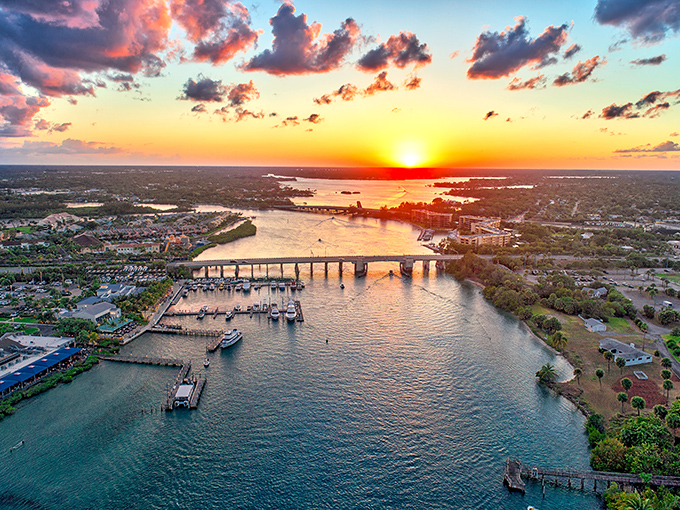 As day surrenders to dusk, Jupiter Inlet glows with golden light, transforming ordinary waterways into pathways of liquid amber.