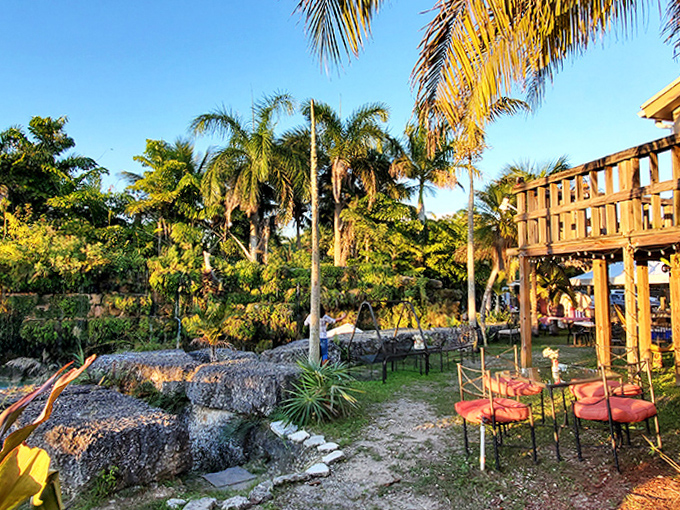 Weathered wooden chairs sink into the white sand, waiting for visitors to kick back with a cold drink between dips.