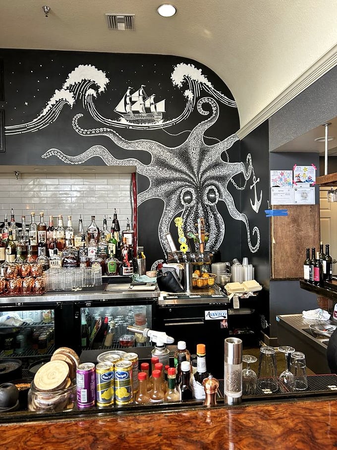 The bar's dramatic octopus mural watches over bottles like a tentacled guardian of good times and perfectly balanced cocktails.