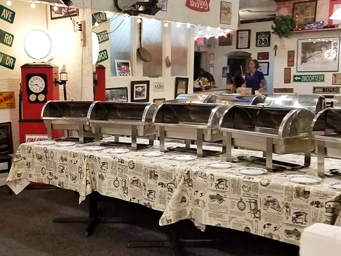 Stainless steel warmers stand at attention, ready to serve up home-style goodness under the watchful eye of vintage street signs.