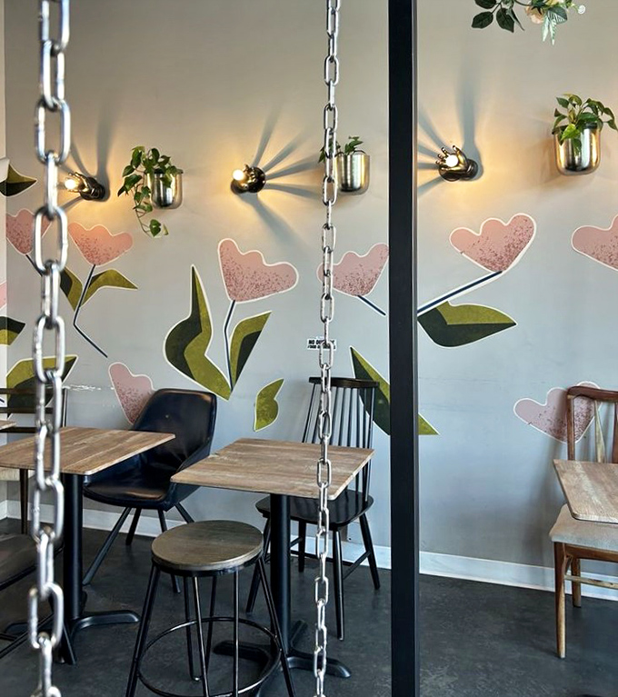 Chains hanging from the ceiling support swings while painted flowers bloom on walls &ndash; because why sit in a regular chair when you can sway?