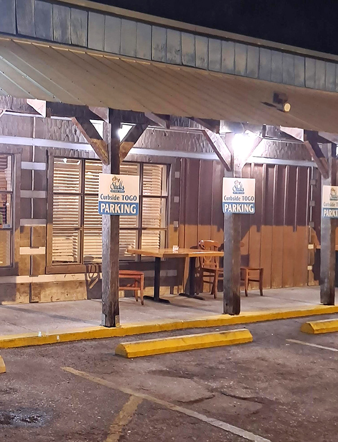 The outdoor seating area offers a casual spot to enjoy your seafood feast al fresco &ndash; simple wooden tables under a protective overhang.