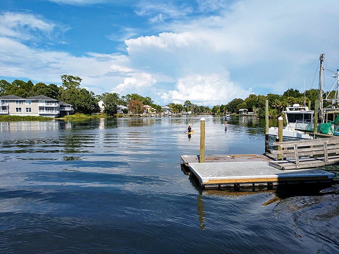 Docks stretch into calm waters like wooden fingers reaching for the heart of Crystal River's aquatic playground.