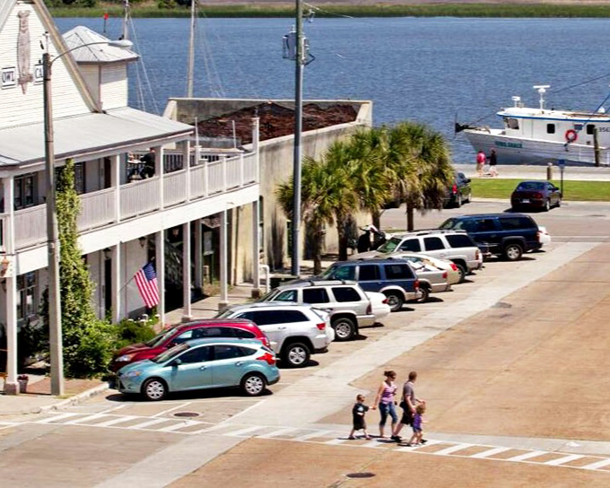 The waterfront at Apalachicola continues its working tradition, with fishing boats bringing fresh seafood to restaurants just steps away.