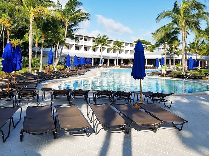 Pool perfection awaits! The inviting blue waters and neatly arranged loungers promise a day of sunshine and relaxation at this Keys retreat.