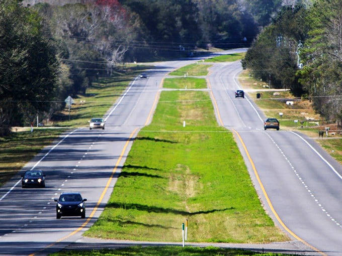 This divided highway cuts through Florida's interior, where cattle ranches and horse farms preserve the state's agricultural heritage.