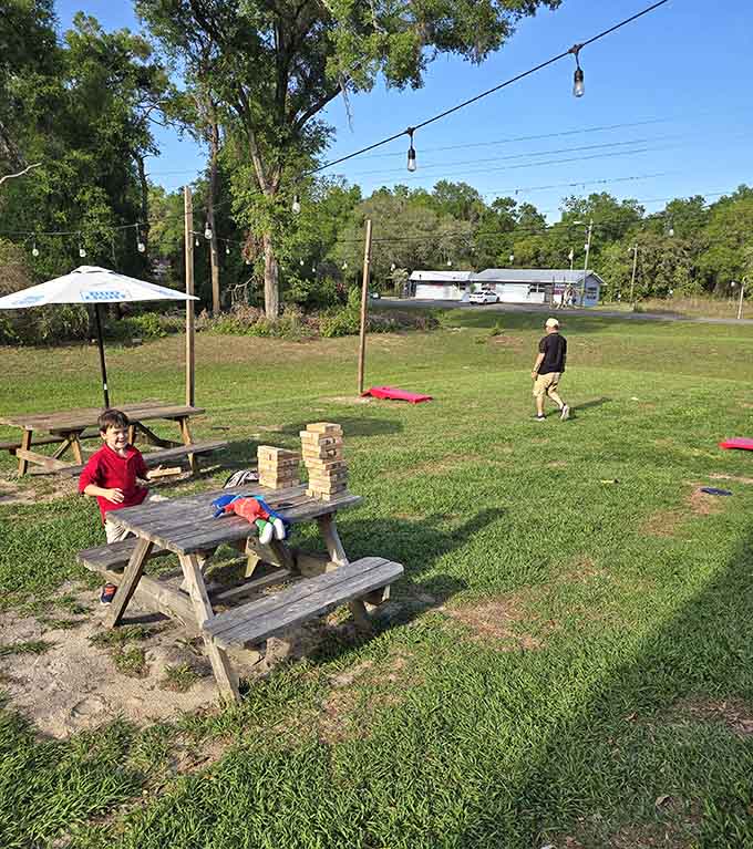 The outdoor patio space invites lingering over meals and games, turning a simple lunch into an afternoon worth remembering fondly.