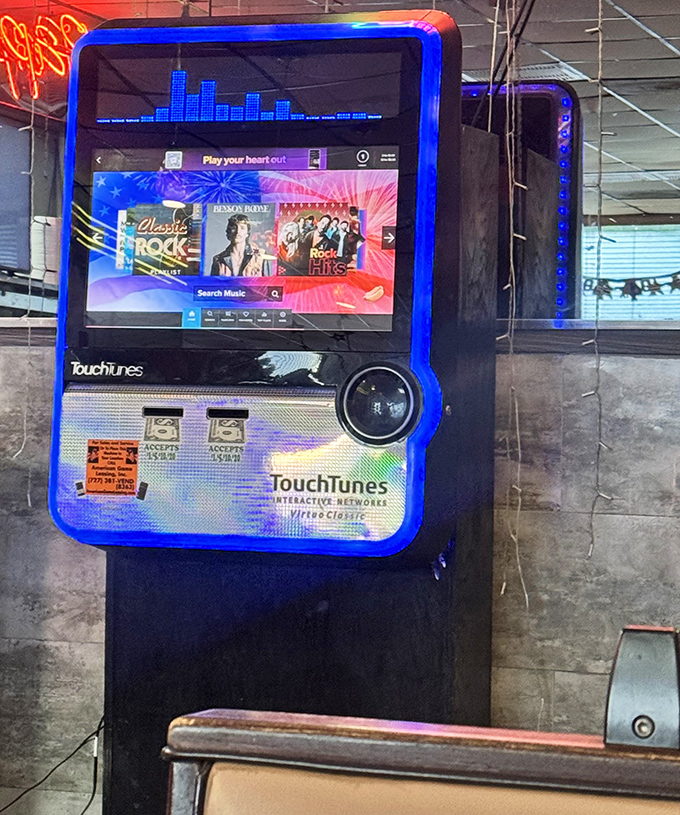 The vintage jukebox stands ready to provide the soundtrack to your meal, adding nostalgic ambiance to the dining experience.