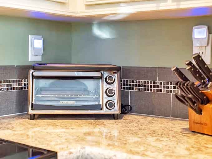 Even the kitchen tools are thoughtfully arranged, promising culinary adventures that might involve the sweet bounty growing just outside.